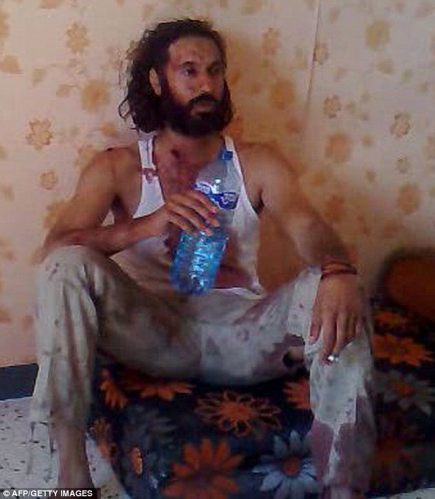 A last cigarette and a swig of water, Gaddafi's son Mutassim pictured before he too died of new ...