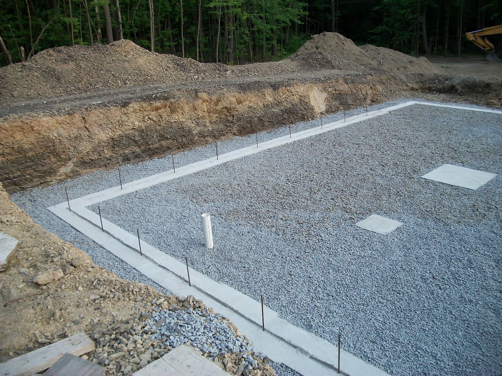 Girl Builds House: Sub-slab #2 stone and footing drain tile.