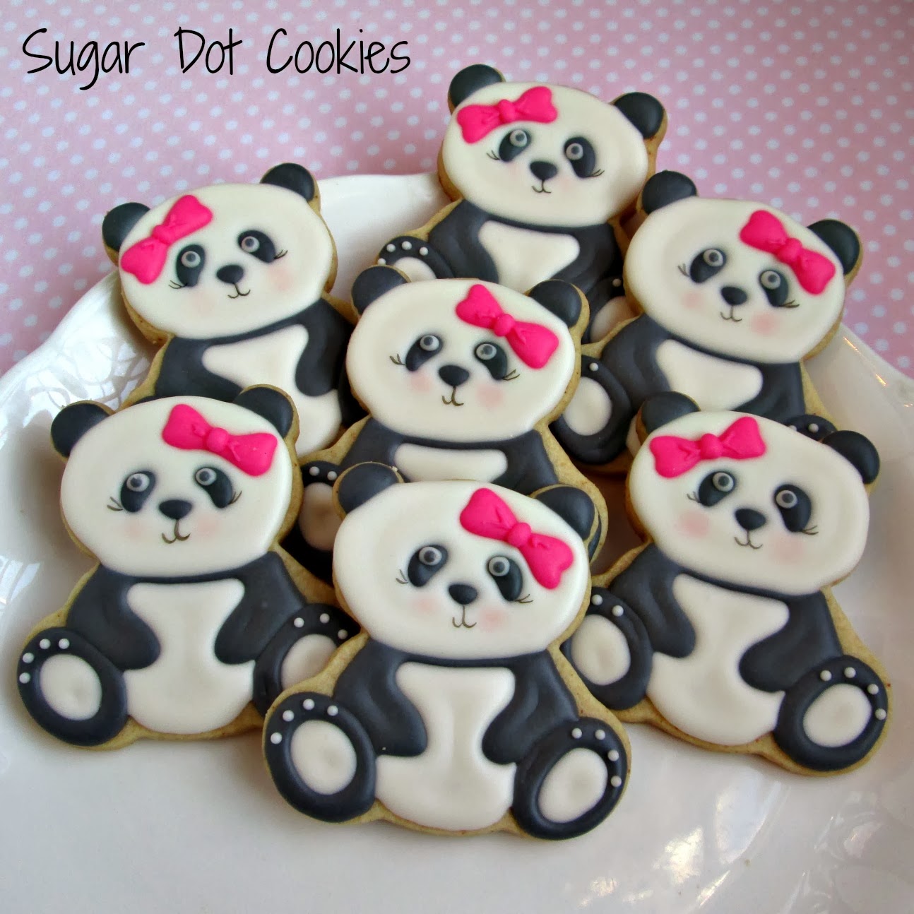 I girlied up my usual pandas - adding pink bows, eyelashes and rosy cheeks.