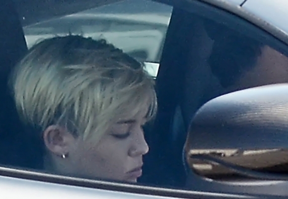 Miley Cyrus photographed in a McLaren MP4-12C - Garage Car