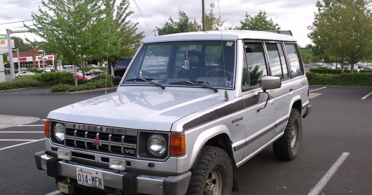 OLD PARKED CARS.: 1988 Mitsubishi Montero.