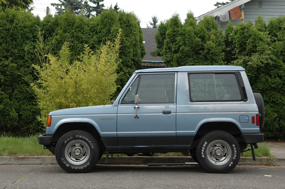 OLD PARKED CARS.: 1983 Mitsubishi Montero.