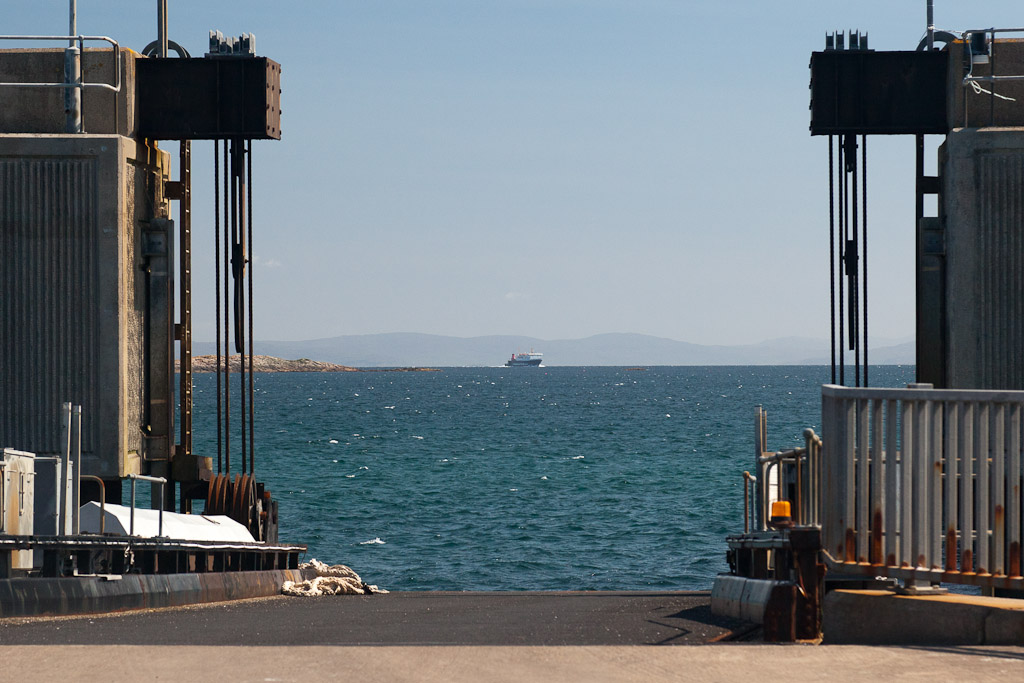 Sea kayaking with seakayakphoto.com: Well composed on Gott Bay pier, Tiree.