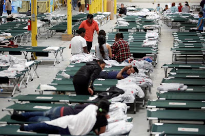 Overcrowded facilities force migrants into temporary shelters in Texas