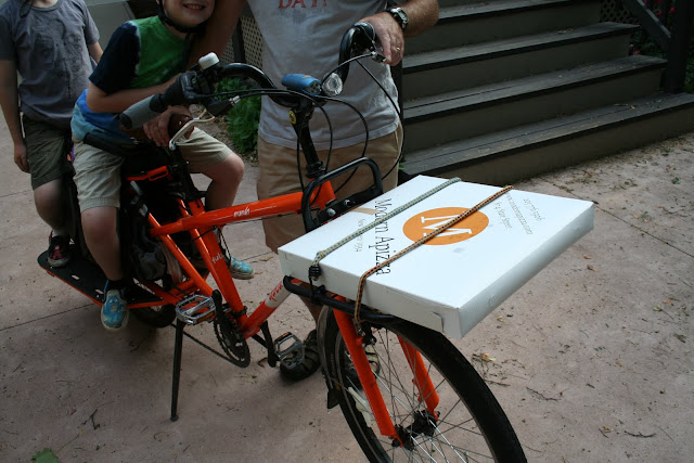 full hands: pizza delivery bike