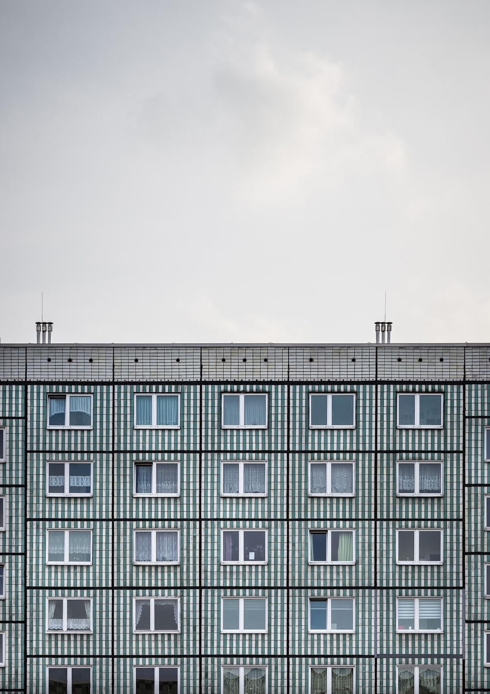 Grey concrete flats, generic office blocks, a grimly rising skyscraper