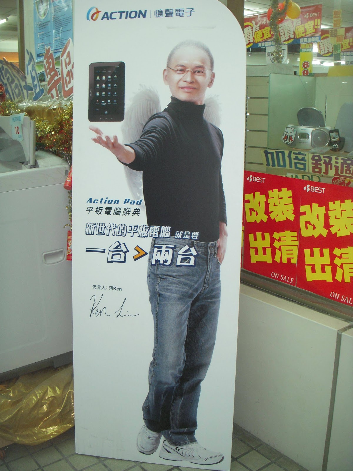 copyranter: Asian angel Steve Jobs impersonator in-store display.