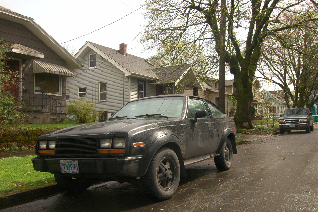 OLD PARKED CARS.: 1980 AMC Eagle SX4.