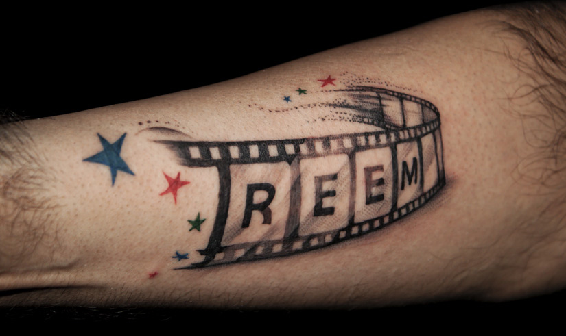 Tattoos Designs, Pictures And Ideas: Name on Camera Reel Tattoo On Arm