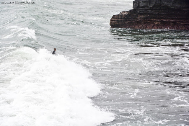 Entree Kibbles: Surfers Surfing on Choppy Waters at Tanah Lot in Bali ...