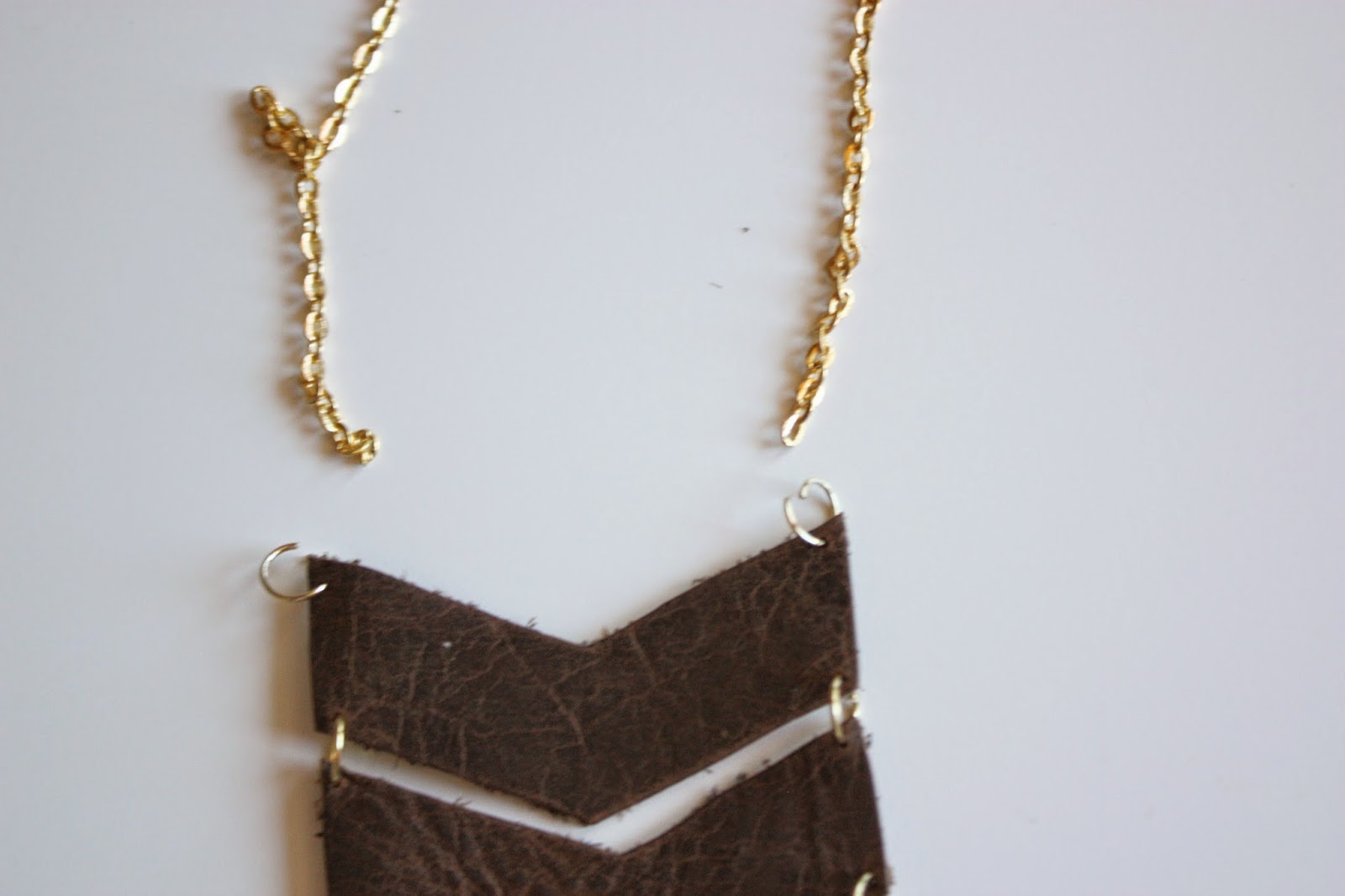 Step 8: Insert ends of chain into top jump rings and close up