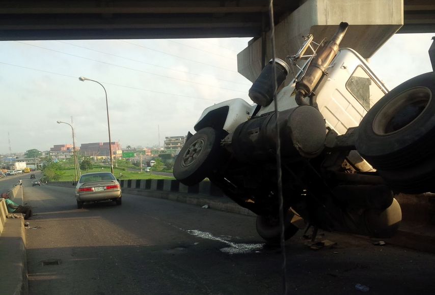 Photos: Truck & Container Fall Off Bridge In Ijora Lagos, 3 Injured ...