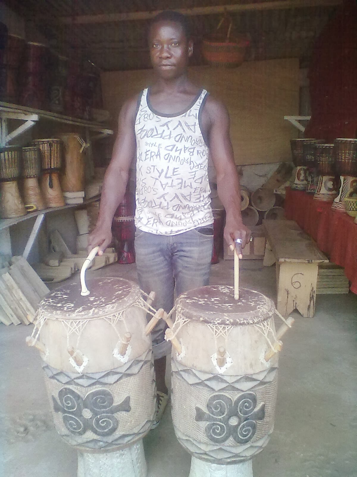 WOOD CARVING IN GHANA: THE TALKING DRUM - ATUMPAN DRUM