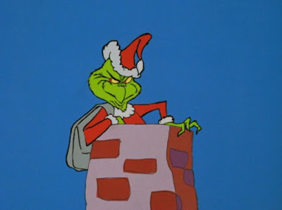 Grinch Holding Sleigh