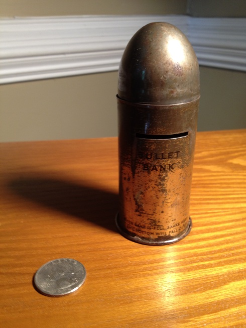 Backstory Antiques: Tin Bullet Bank