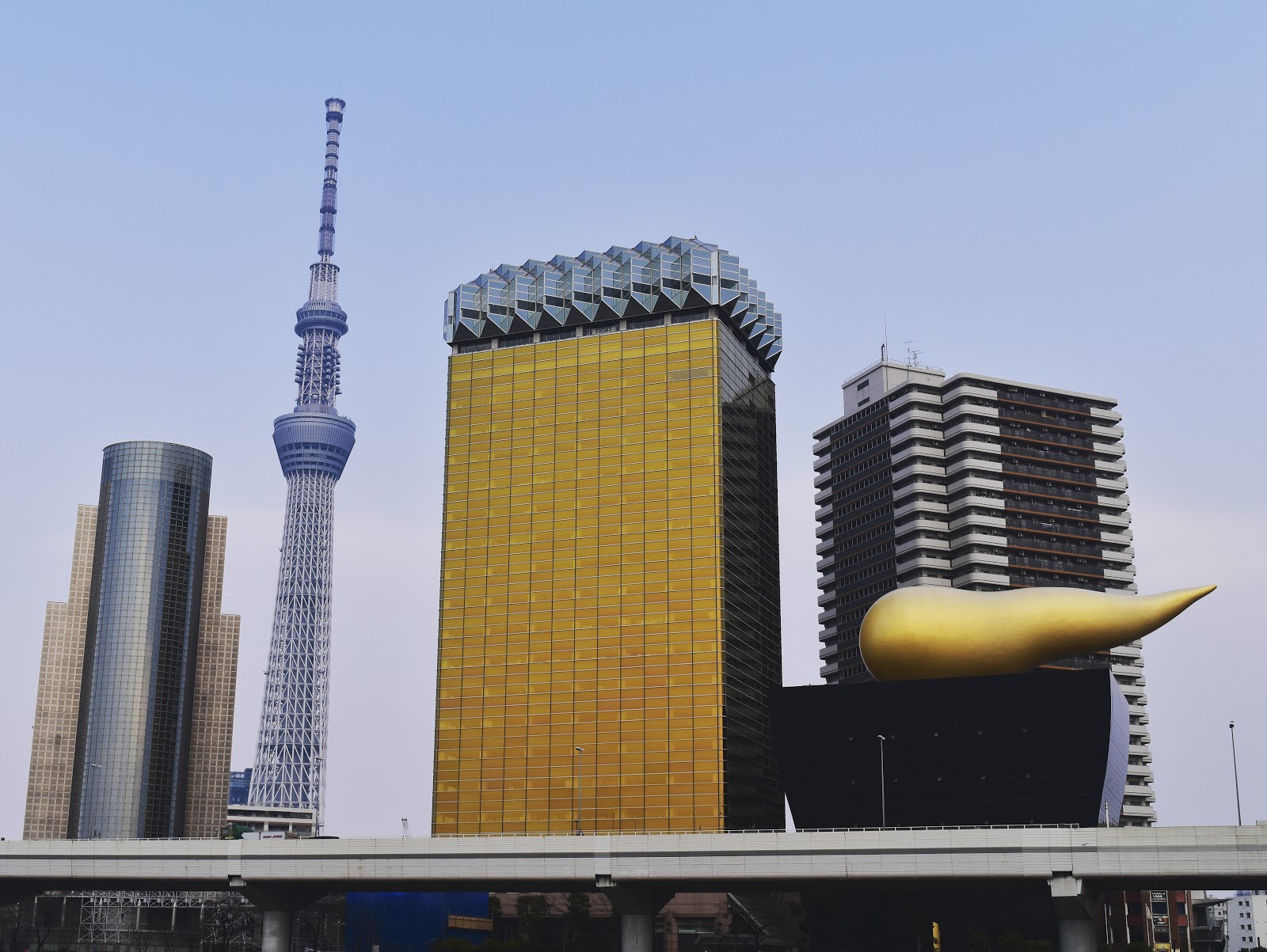 Sky tree and Asahi beer hall on right. Two signature tower of tokyo and ...