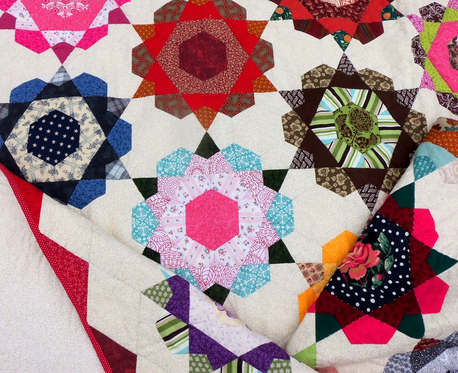 Orange explains it all: Rose Star quilt finished, at last.