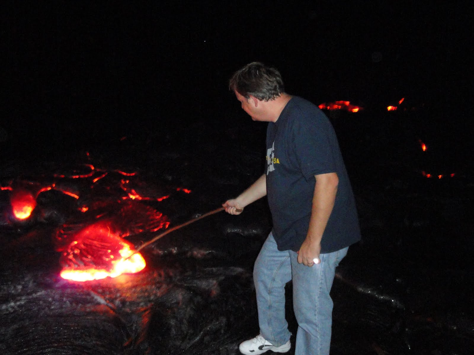 16 People Poking Lava