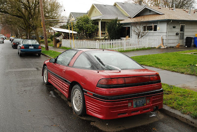 OLD PARKED CARS.: 1990 Plymouth Laser.
