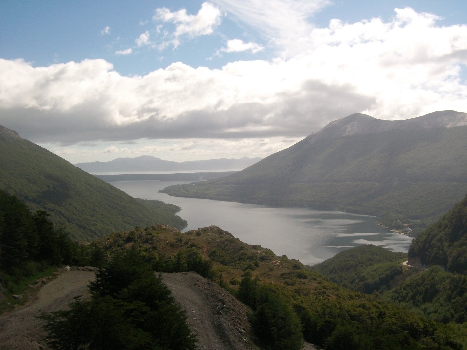 Lago Escondido is surrounded by forests and steep mountain ranges.
