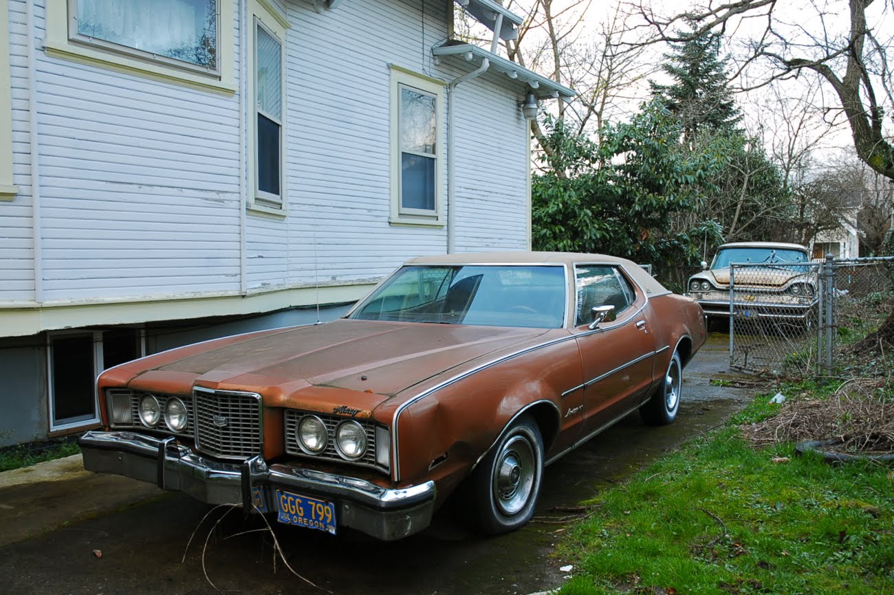 OLD PARKED CARS.: 1973 Mercury Montego MX Brougham.