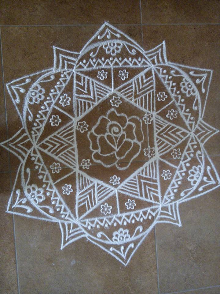 CHODAVARAMNET: FLOWER IN A TRIANGLE STAR RANGOLI ART