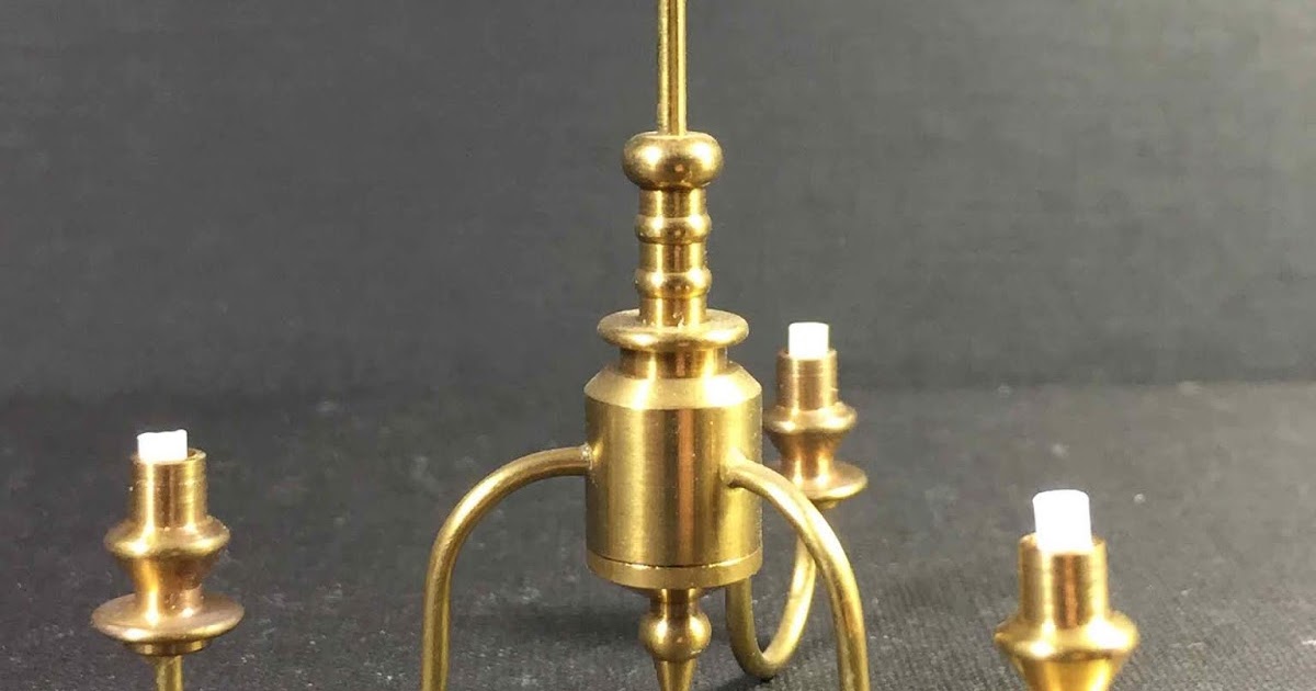 Four Ray Storey three arm chandeliers