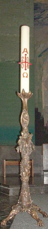 Wonderful in an Easter kind of way: decorating the paschal candle by hand