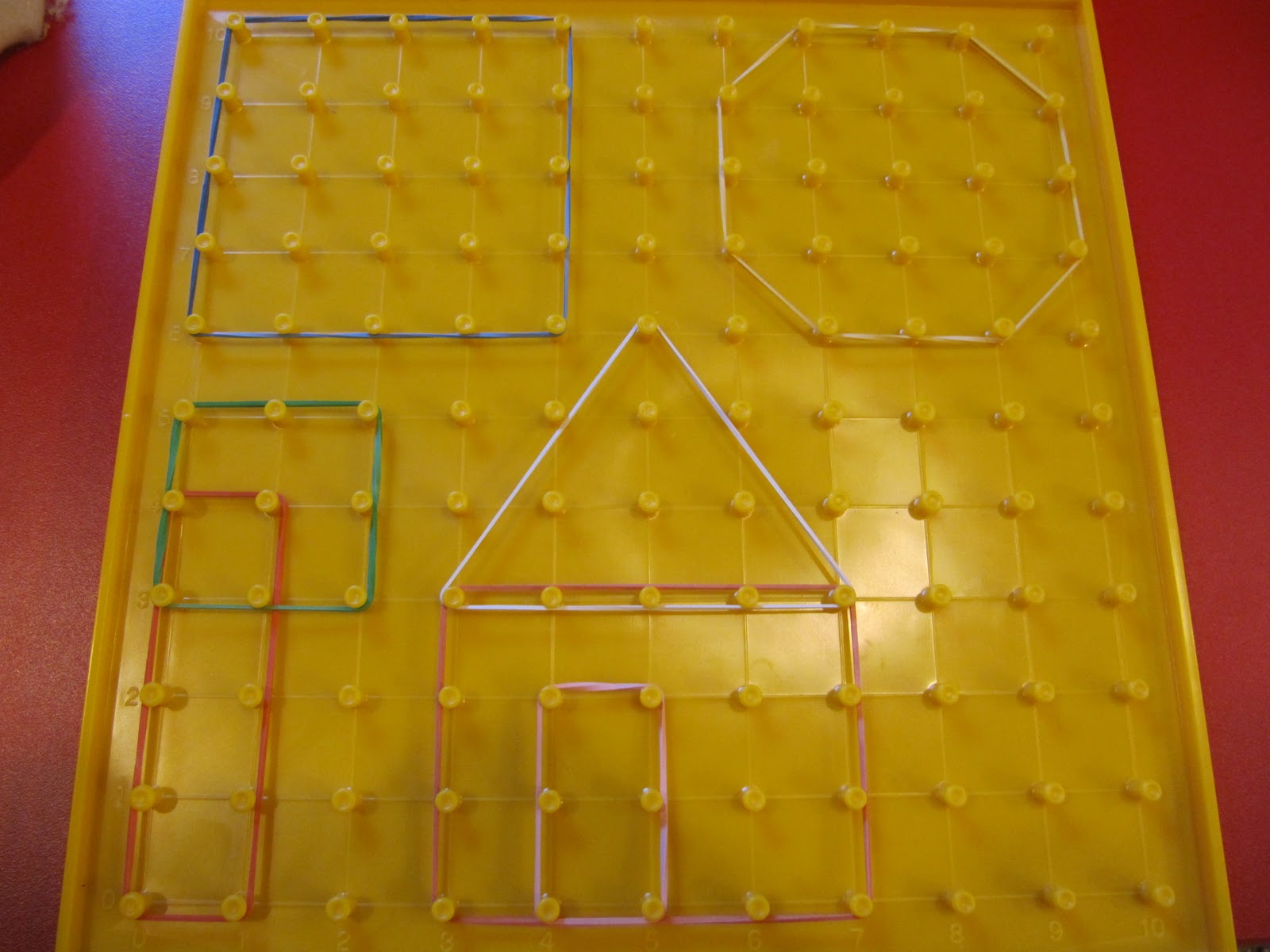 Peg boards with rubber bands! The ones at my school were literally wood ...