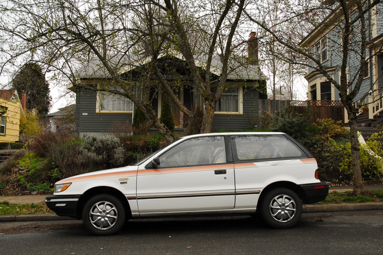 OLD PARKED CARS.: 1991 Mitsubishi Mirage.