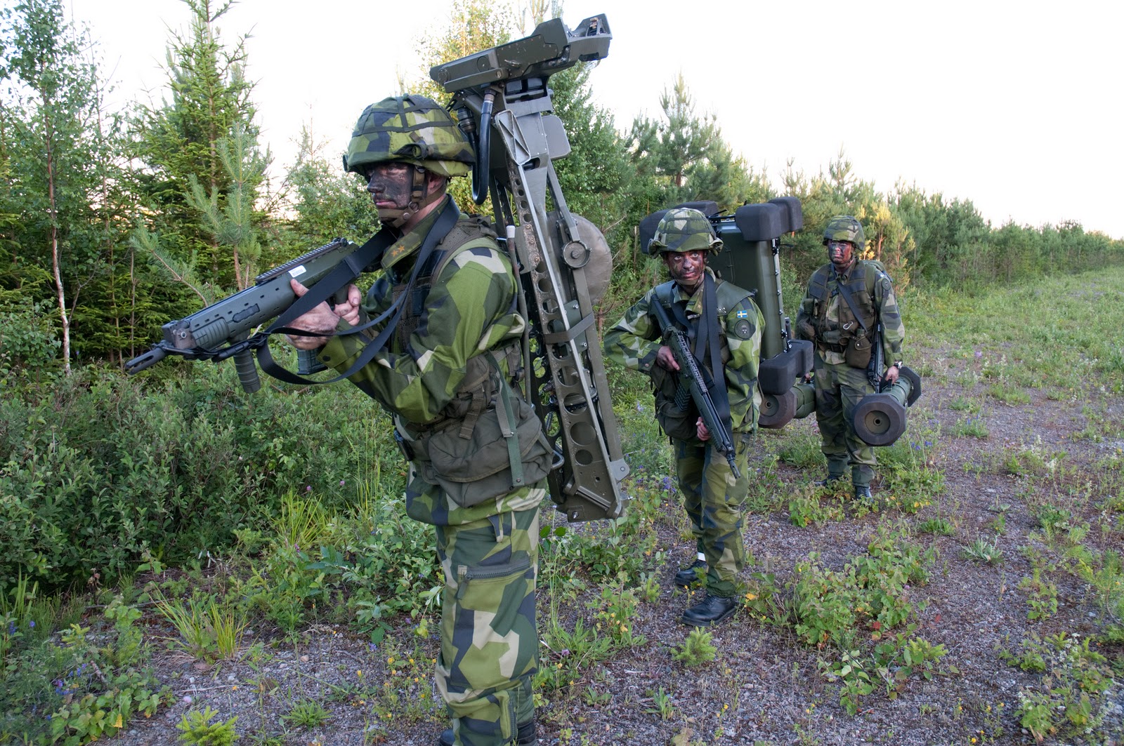 A squad of Swedish soldiers from the Air-Defense Regiment (Lv6) carries ...