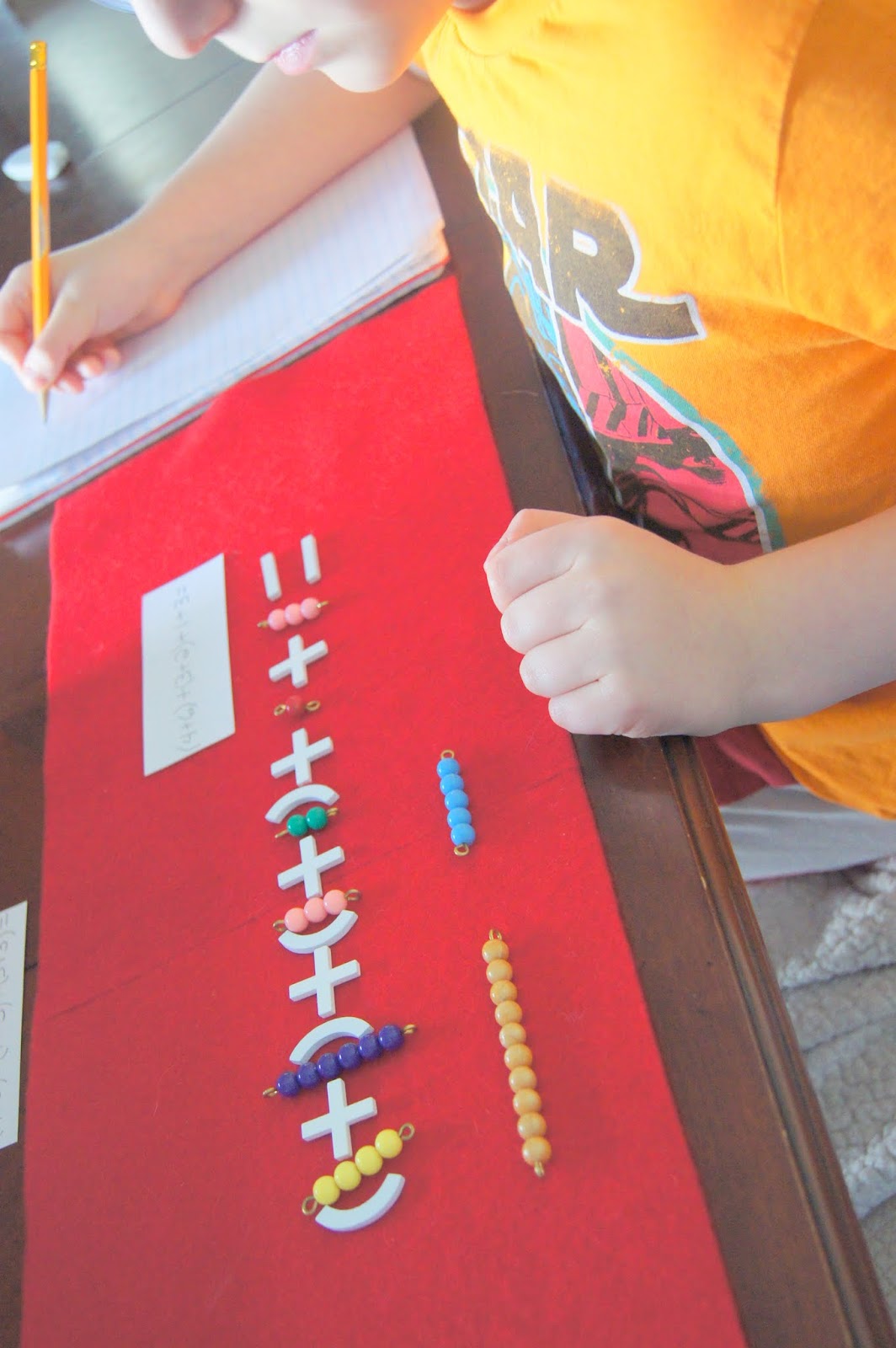 montessori-addition-tables-work-coloured-bead-bars-making