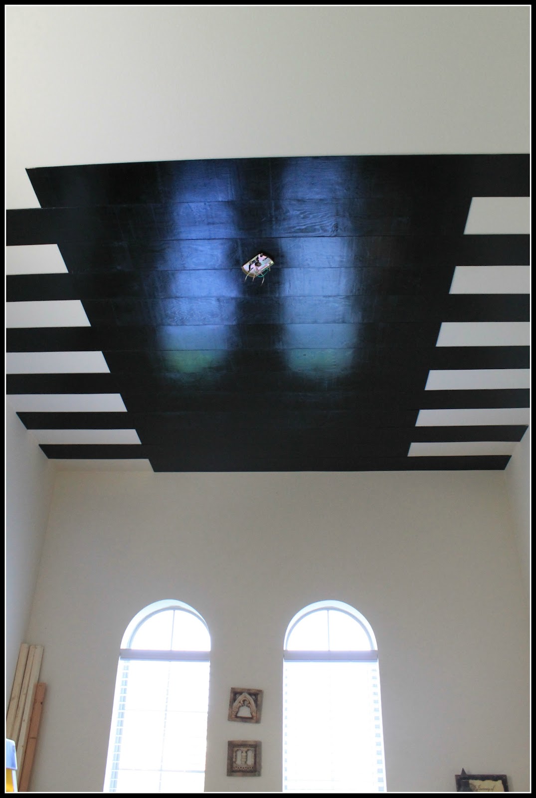 Make Them Wonder: Glossy Black Plank Ceiling