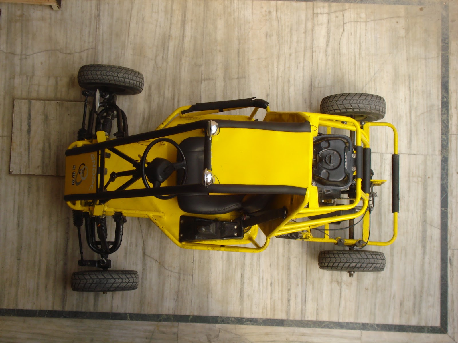 REVVING MOTOR WORKS: TOP VIEW OF GO KART