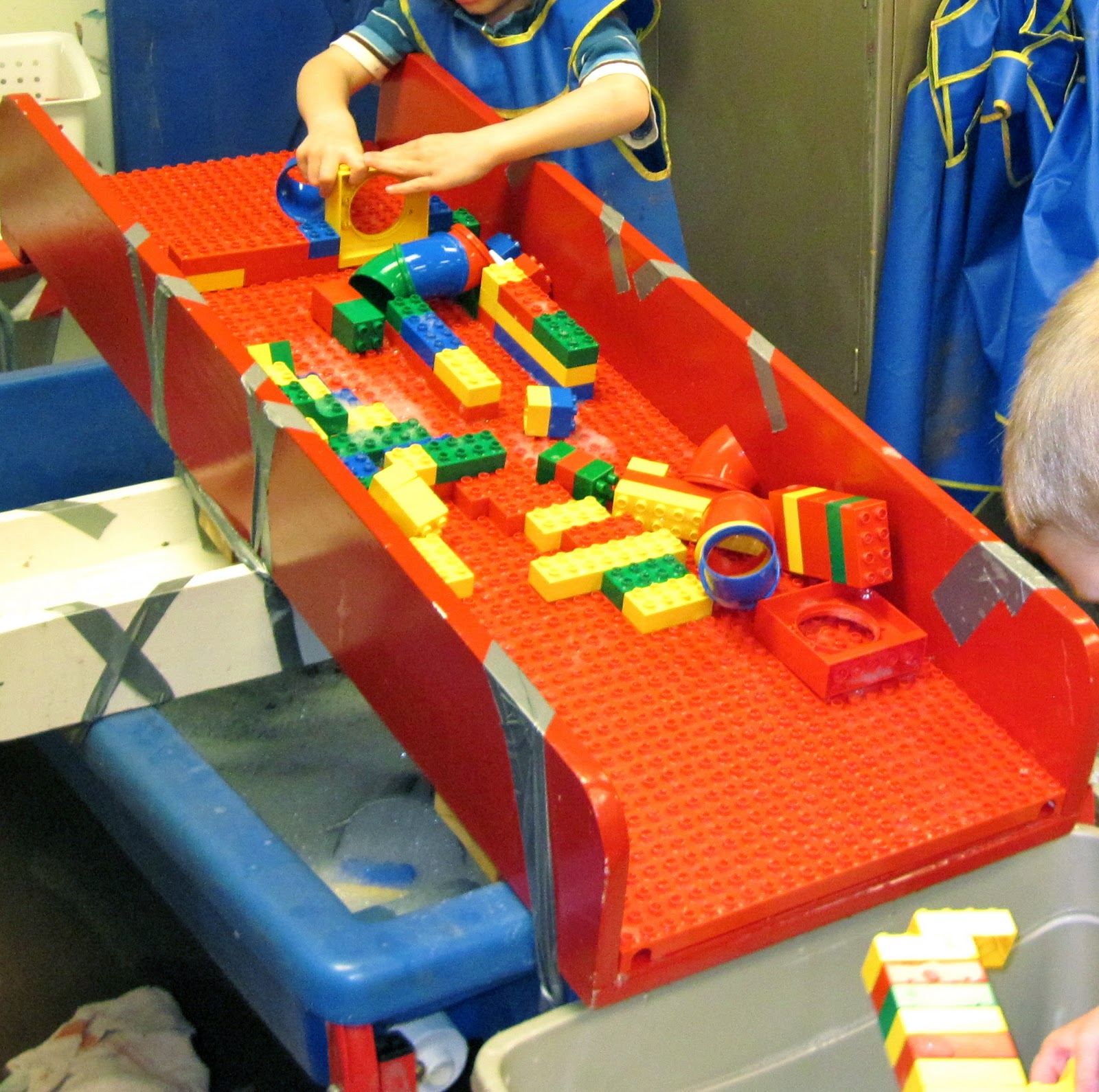 SAND AND WATER TABLES: DUPLO BOARD RAMP
