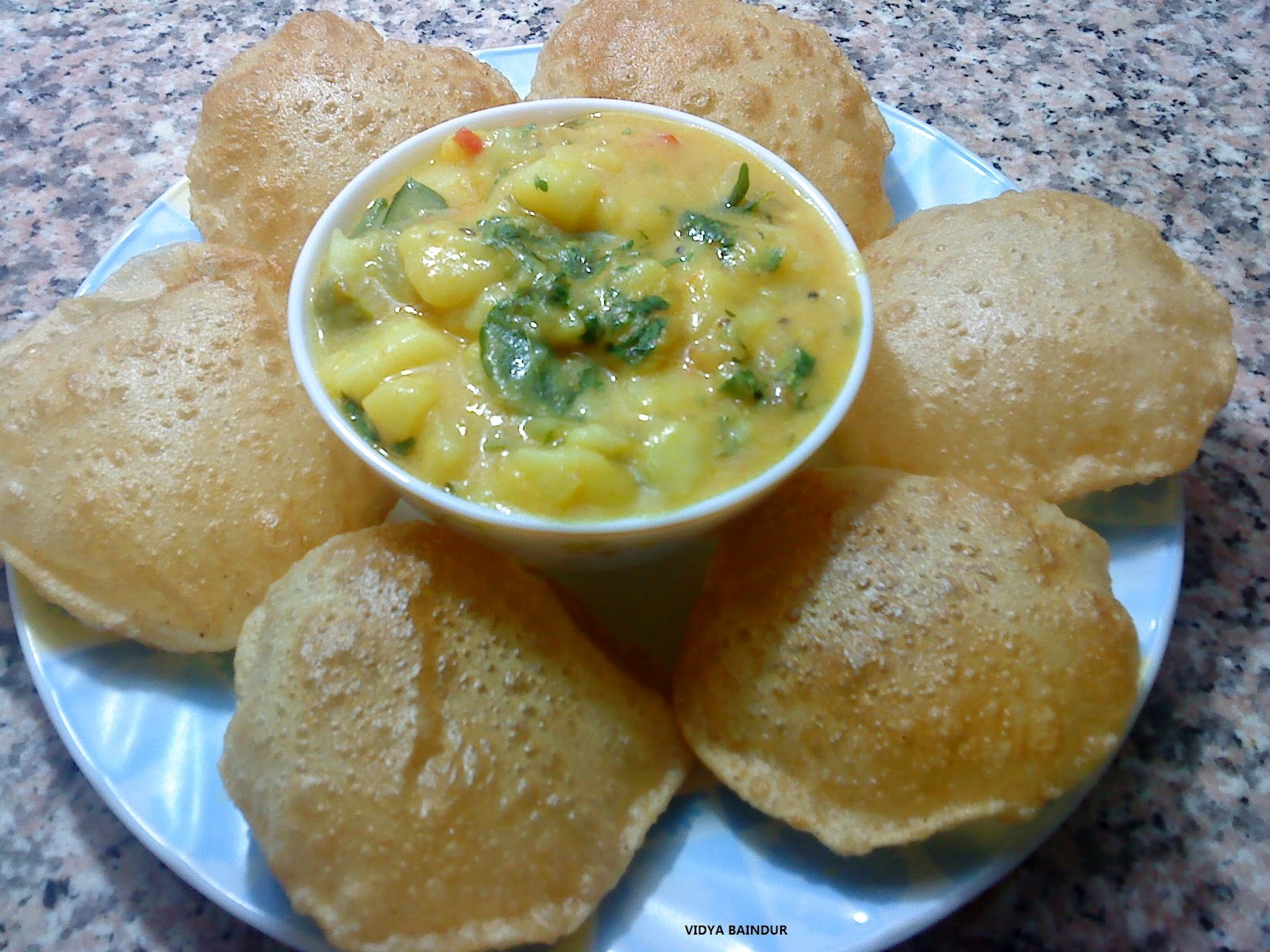 Poori Bhaji ... Potato Bhaji or Rassa with some change..so tasty served ...