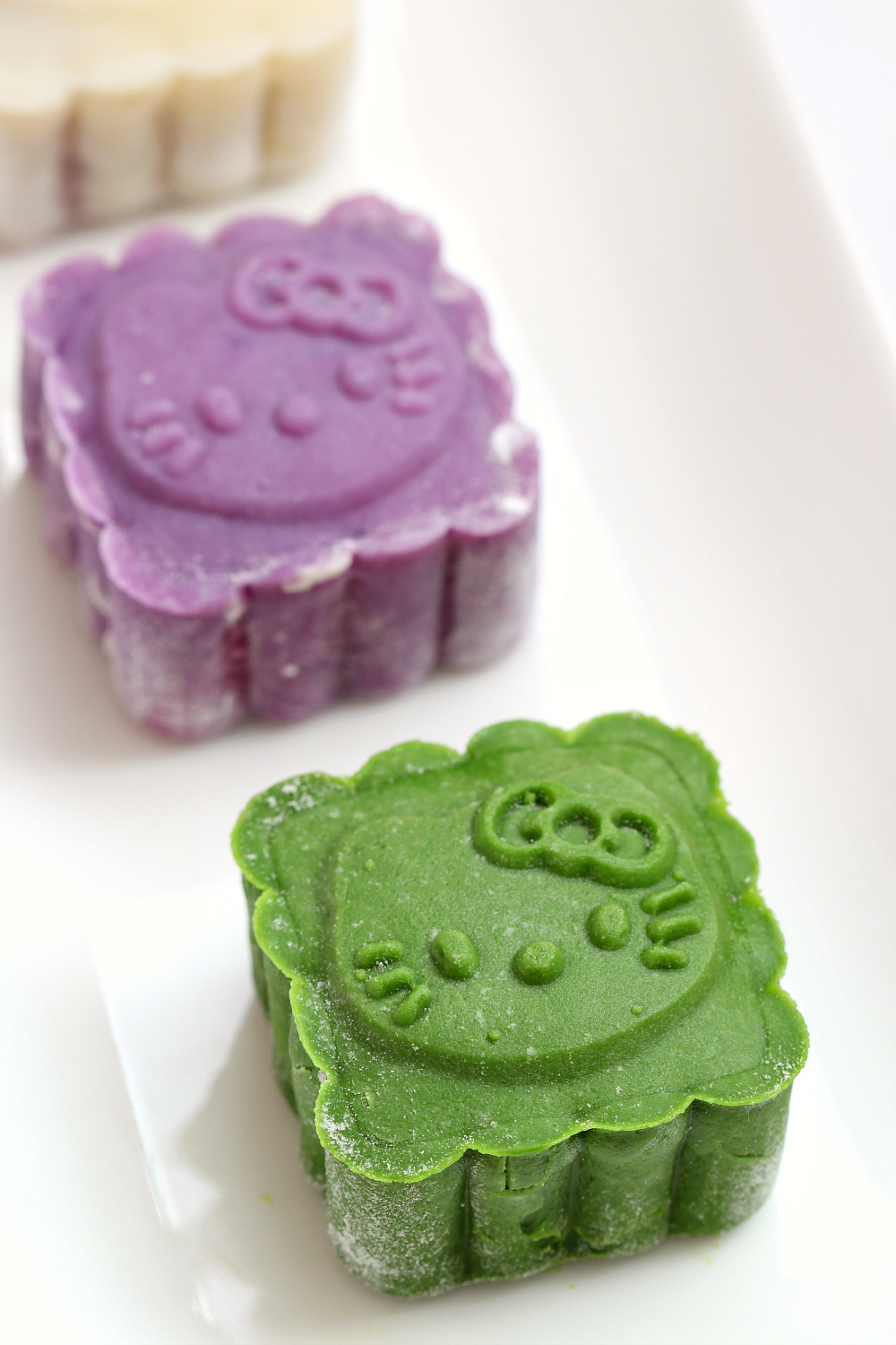 Snowskin mooncakes with purple sweet potato and cream cheese filling