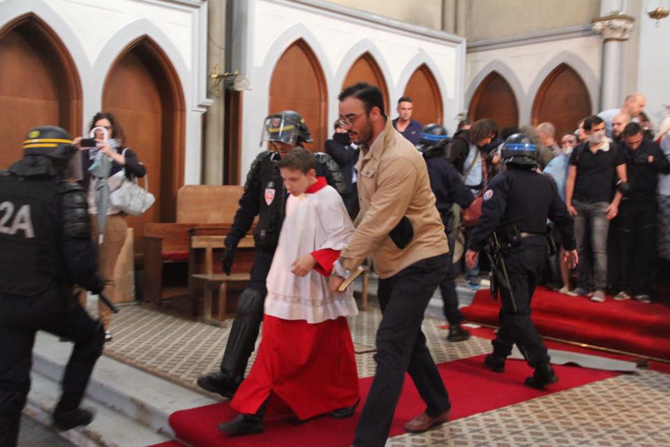#BreakingNews Priest dragged out of Church by Police in Paris during ...