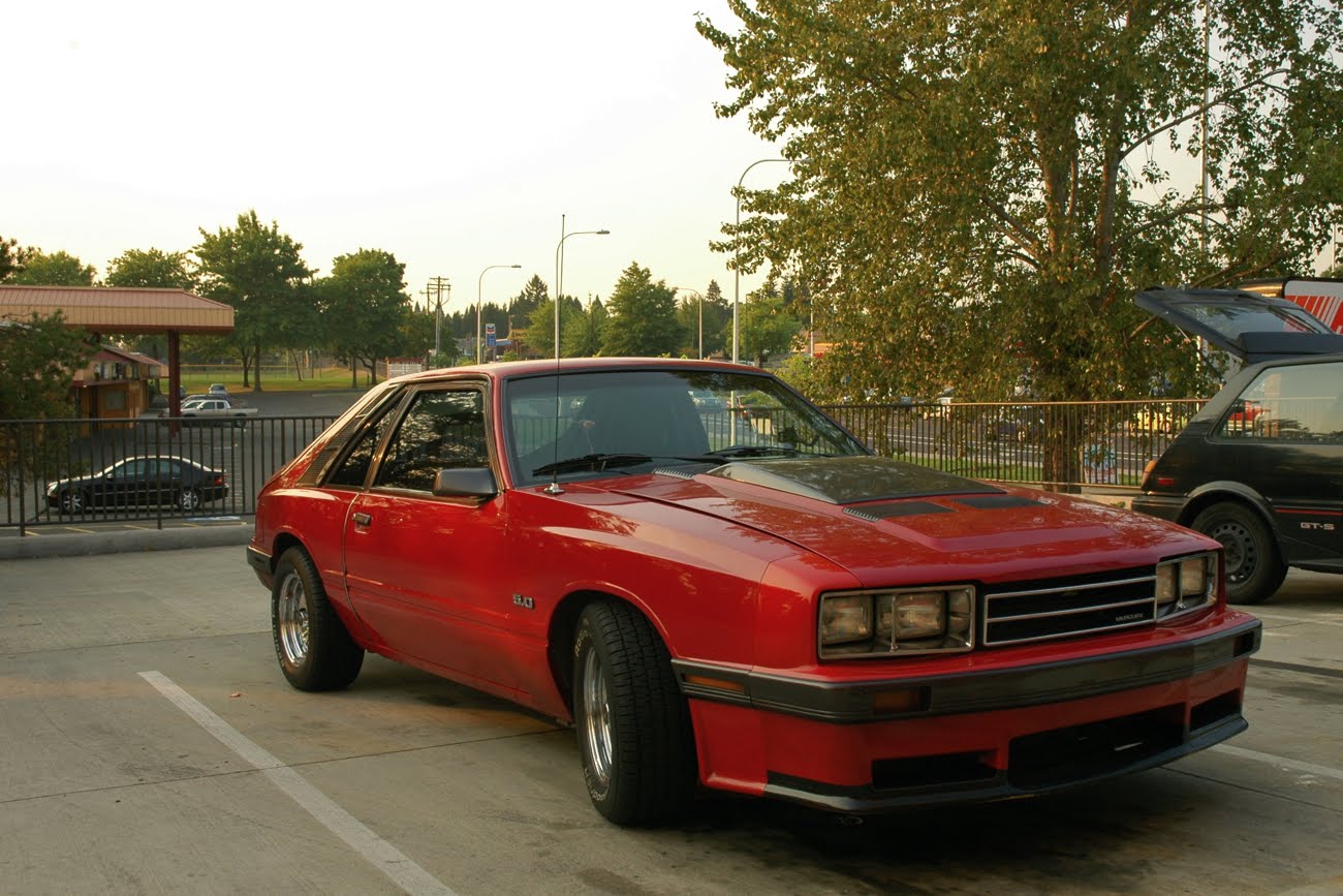 OLD PARKED CARS.: 1985 Mercury Capri.