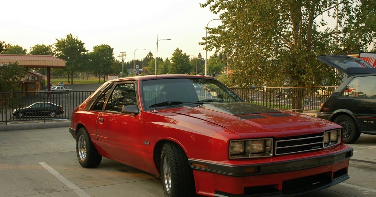OLD PARKED CARS.: 1985 Mercury Capri.