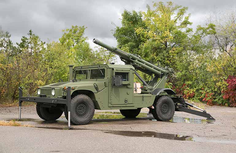 DEFENSE STUDIES: AM General Unveils 105 mm Howitzer Mounted on 4x4 Vehicle
