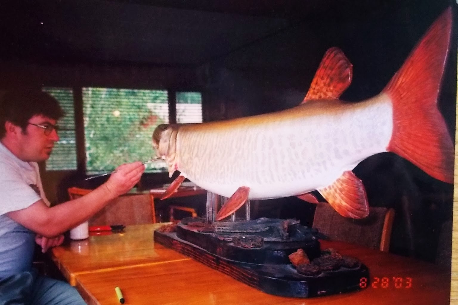 CHARLES WEISS ART: Repainting a wood carved Muskie at Vermilion Bay ...