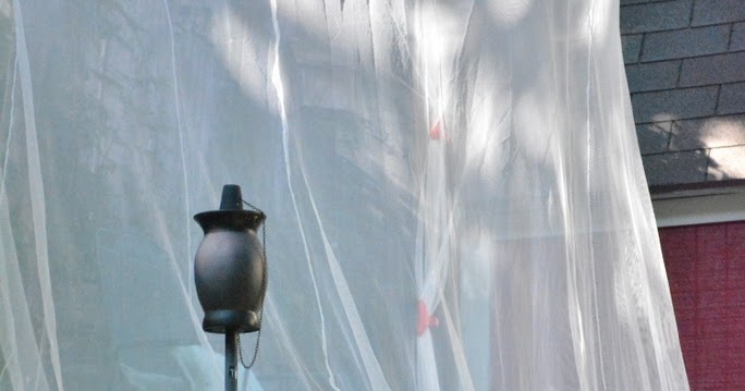 Let's Add Sprinkles: IKEA Mosquito Netting Around the Stock Tank Pool