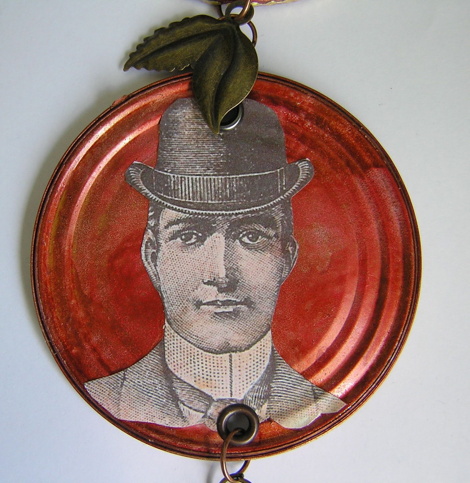 wall hanger - altered tin can lids