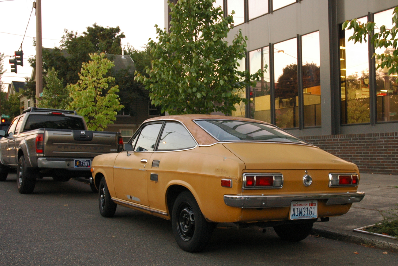 OLD PARKED CARS.: 1971 Datsun 1200 Fastback.