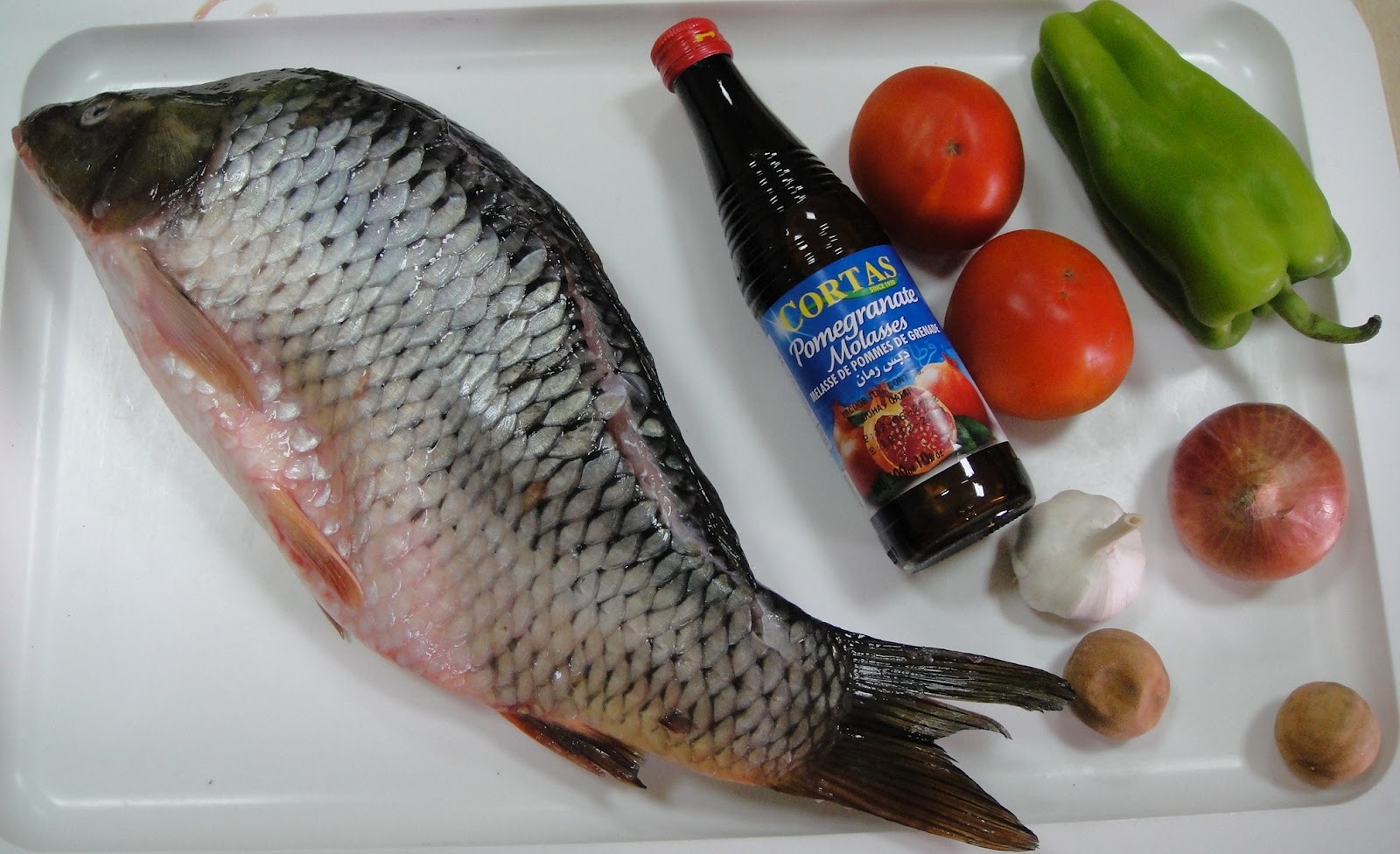 Maryam's Culinary Wonders: 180. Iraqi Whole Fish in Pomegranate Molasses