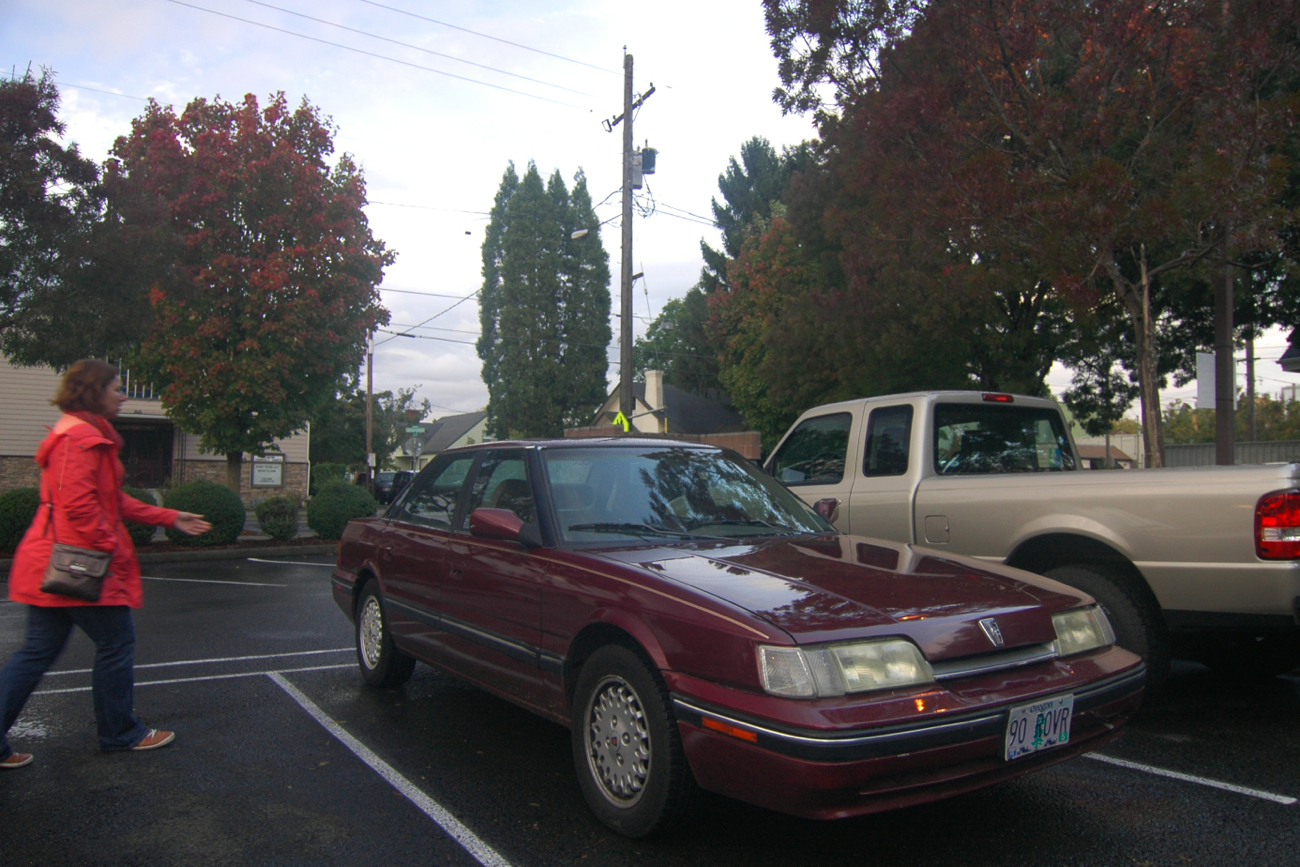OLD PARKED CARS.: 1990 Sterling 827 SL.
