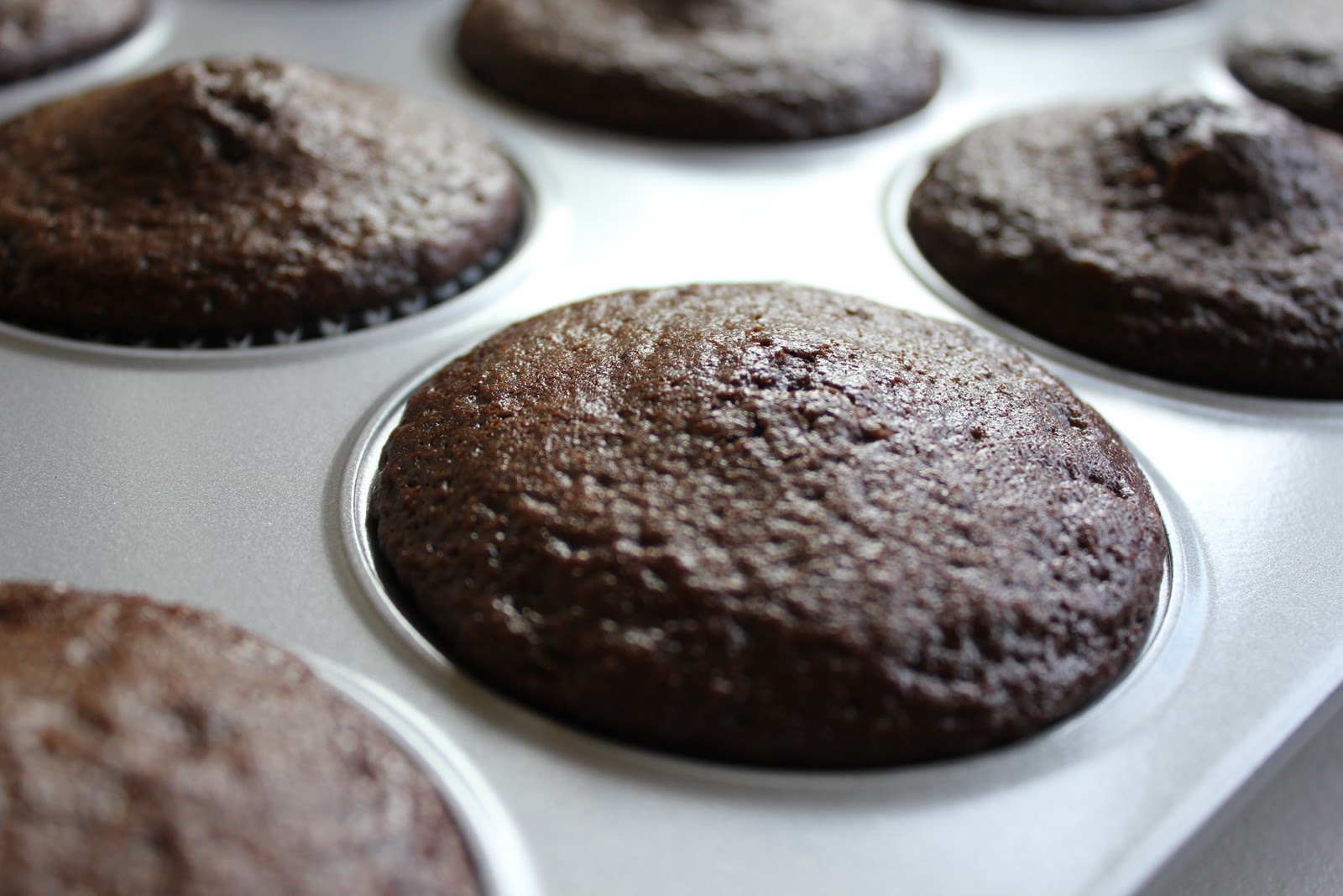 The Happy Glut: Chocolate cupcake with caramel frosting topped with ...