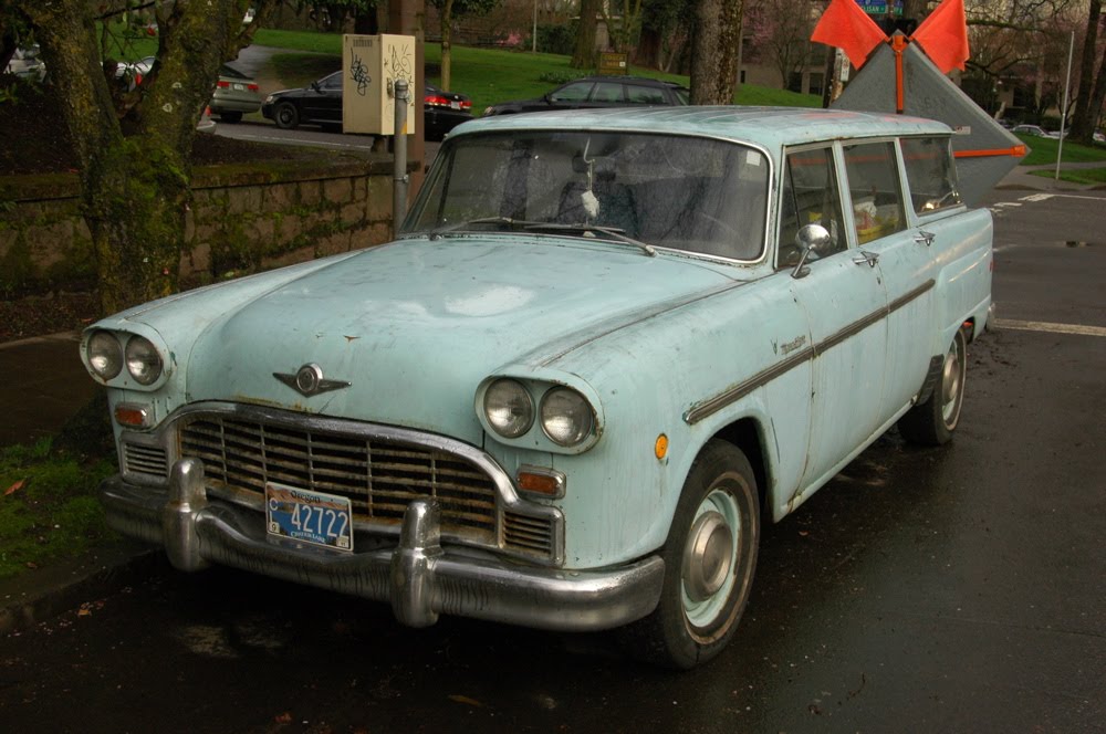 OLD PARKED CARS.: 1970 Checker Marathon Station Wagon.