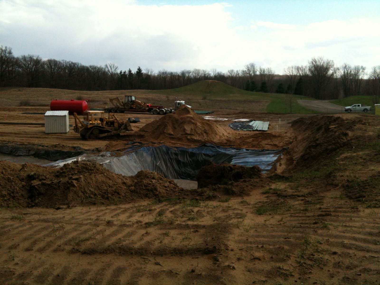 Adrian - Oil and Gas: Pipeline Lined Up - Open Pit on Drill Site in ...